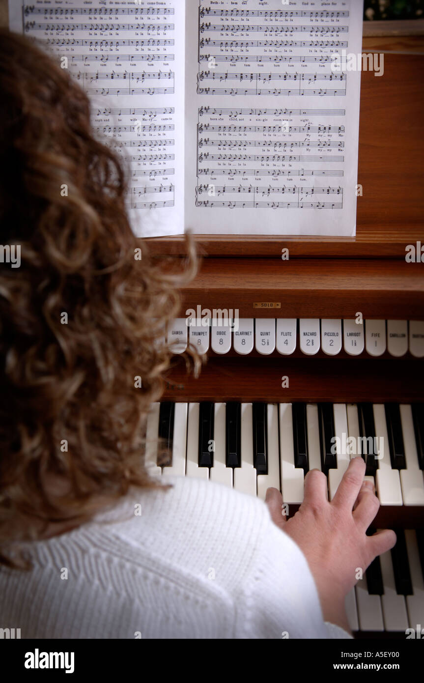 Woman playing organ hi-res stock photography and images - Alamy