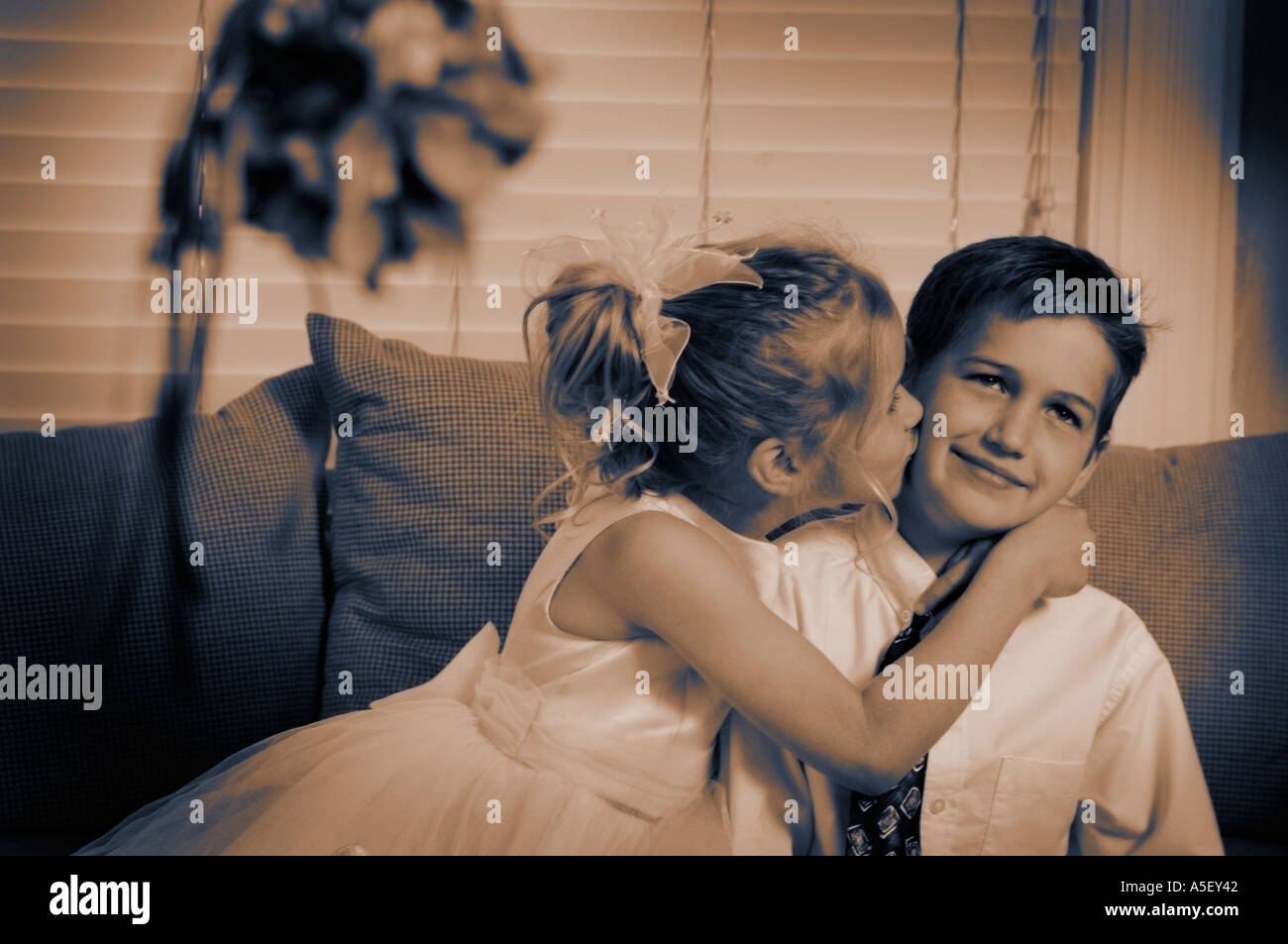 Kissing under mistletoe children hi-res stock photography and images ...