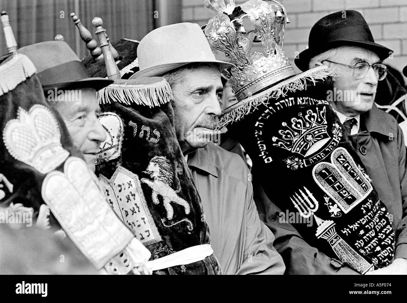 Orthodox Jews carrying Torah scrolls in procession at a synagogue at ...