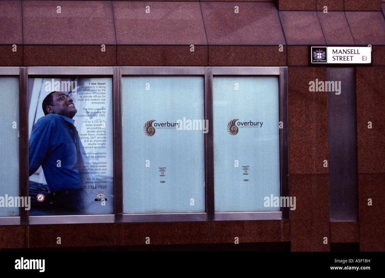 Advertising posters lined the windows on Mansell Street Stock Photo - Alamy