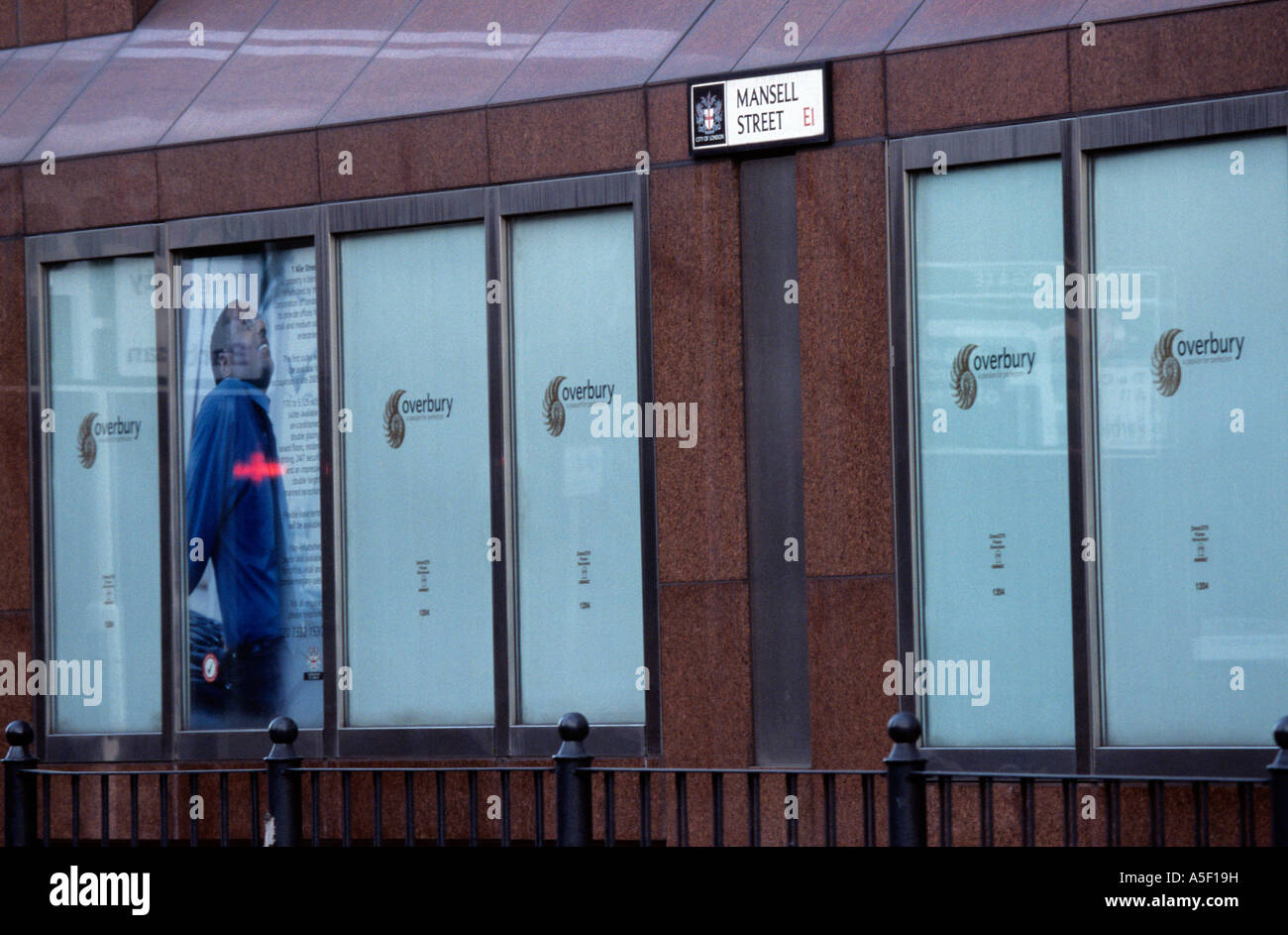 Advertising posters lined the windows on Mansell Street Stock Photo - Alamy