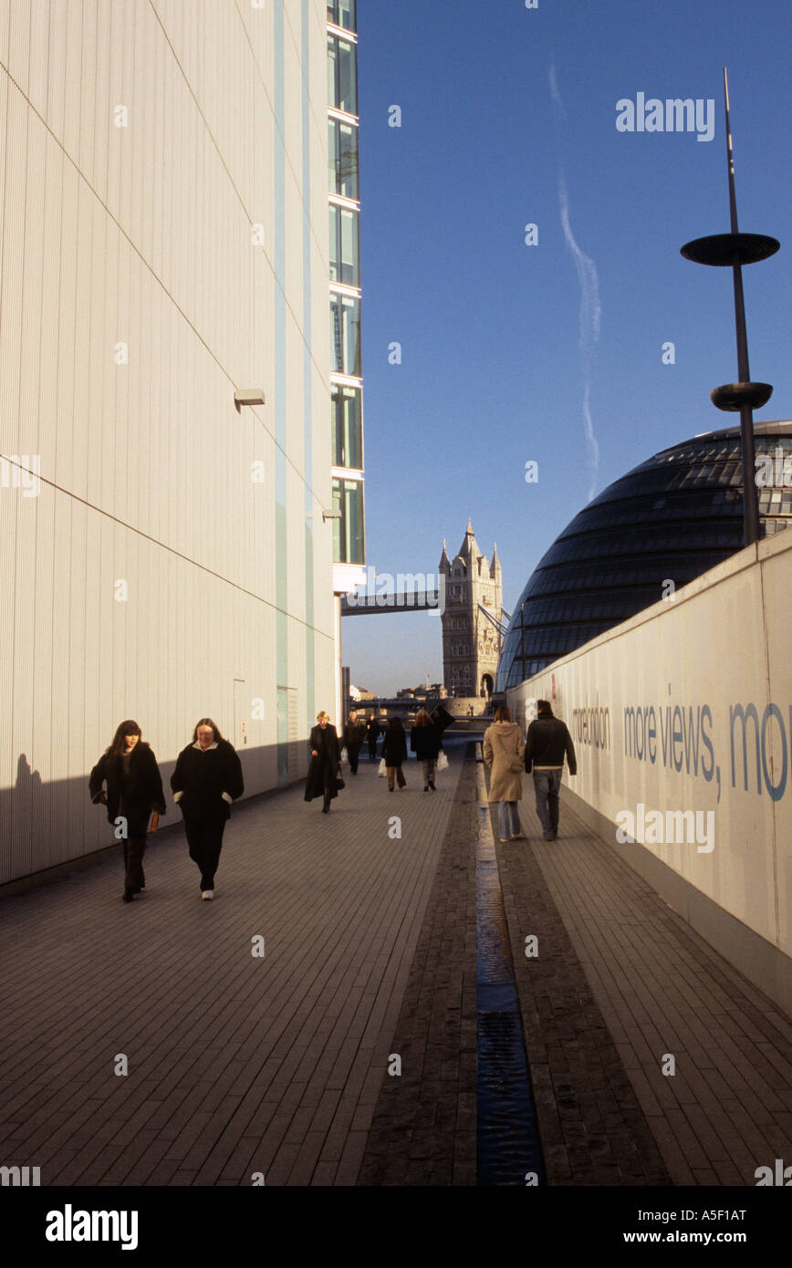 A walkway in London with the Tower Bridge visible in the background ...