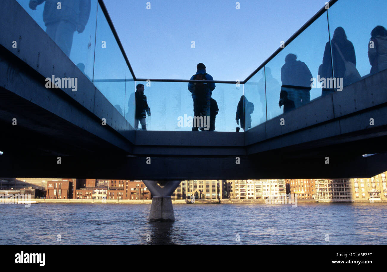 A view of the Thames waterfront from underneath the Millenium Bridge ...