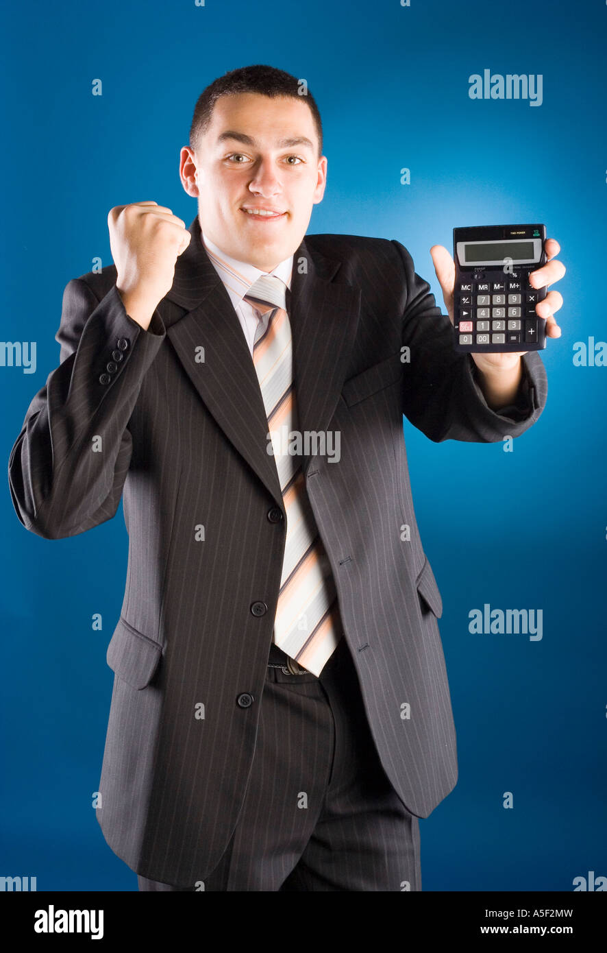happy businessman with calculator in his hand blue background Stock ...