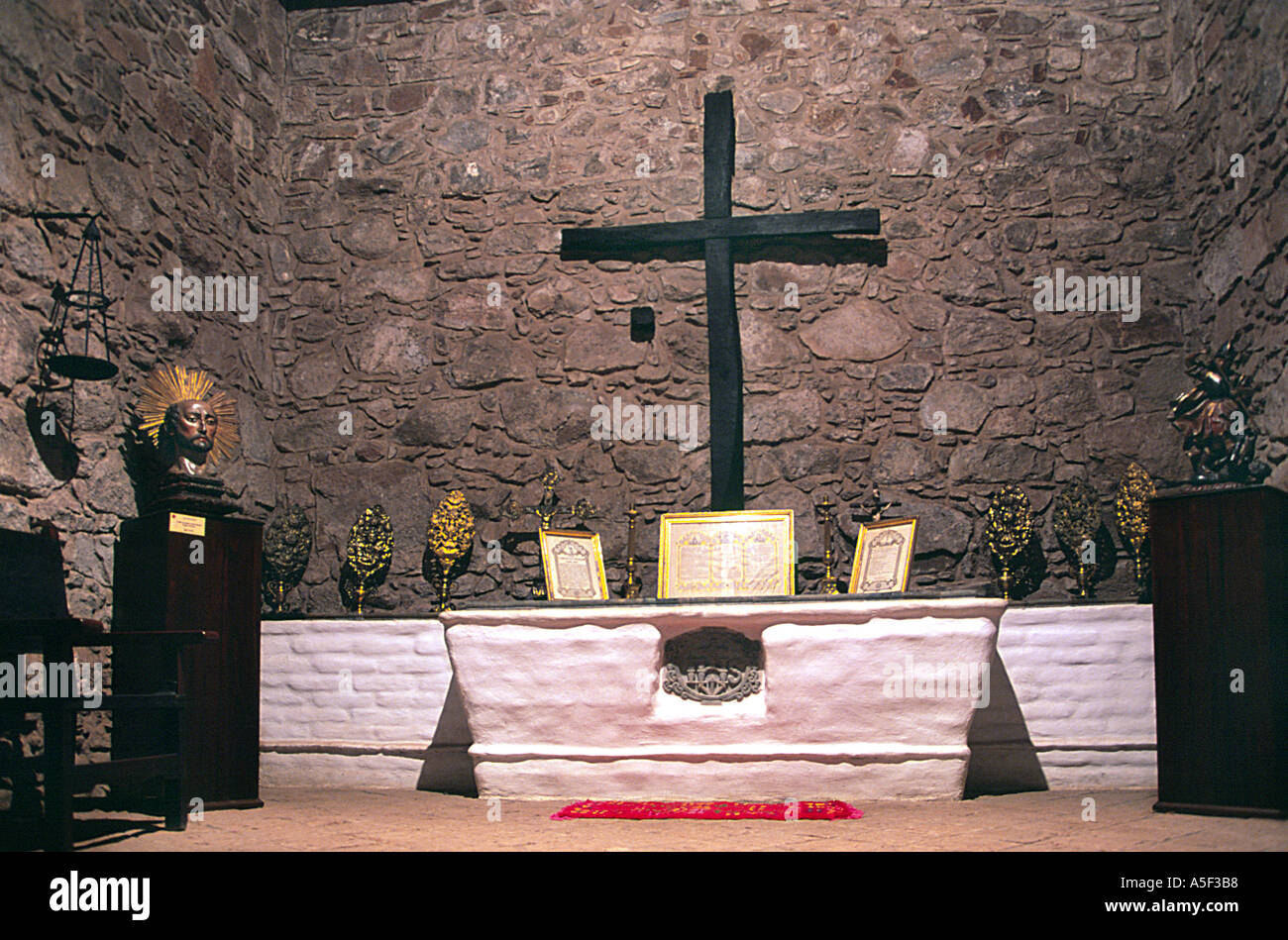 Simple altar inside an old church within a Jesuit residence in Jesús ...