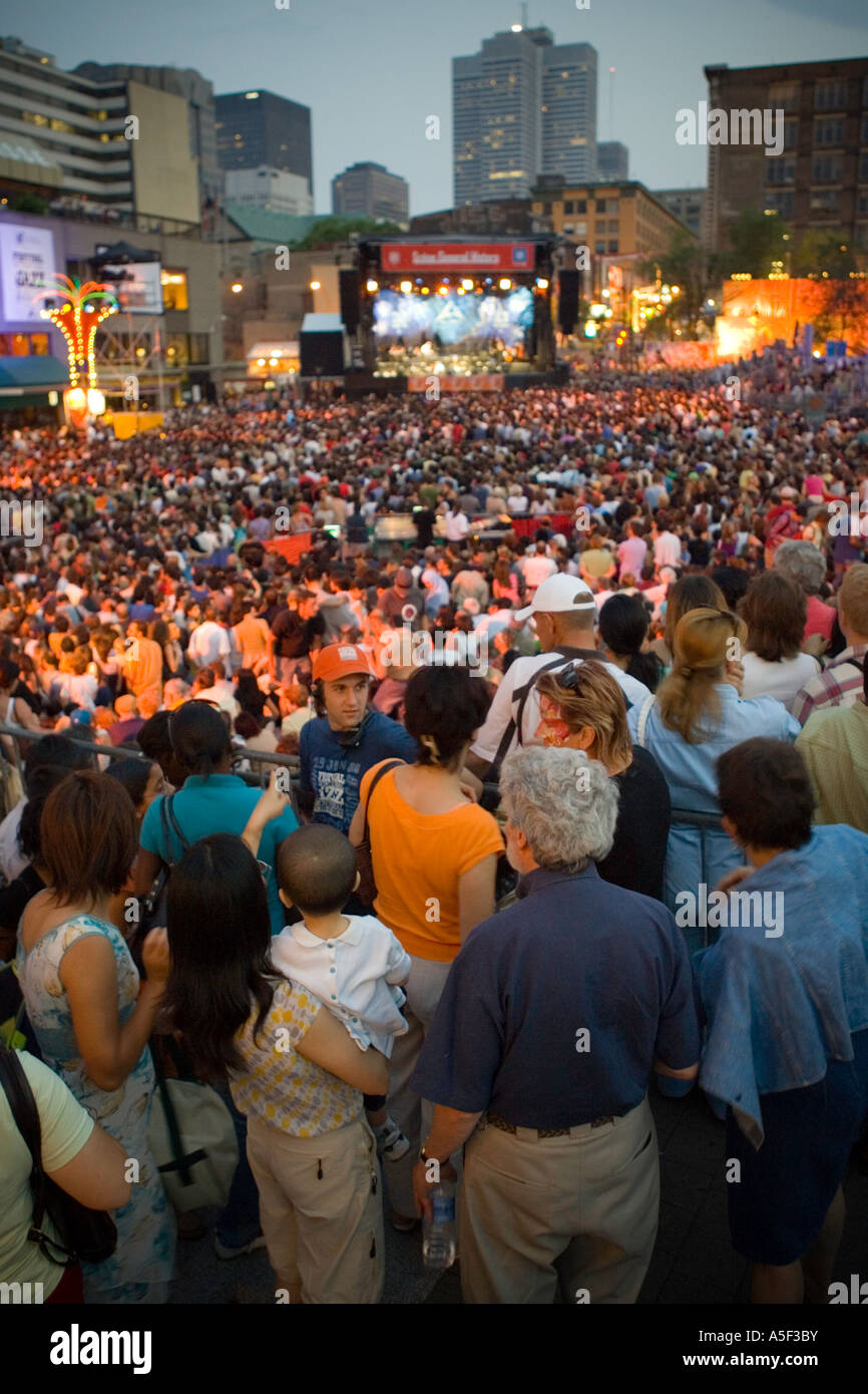 Crowds attending an evening performance at an outdoor music festival in ...