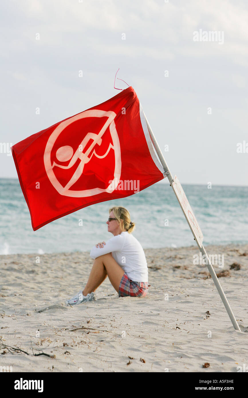 no swimming red flag on a beach ban prohibit windy sea water danger ...