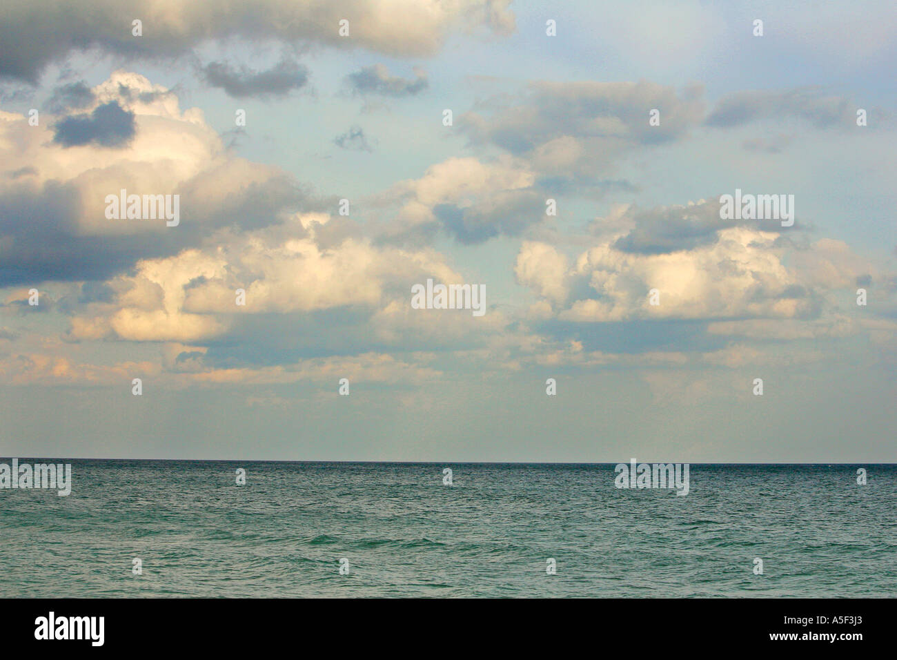 ocean water blue sky clouds sunset infinity endlessness background ...