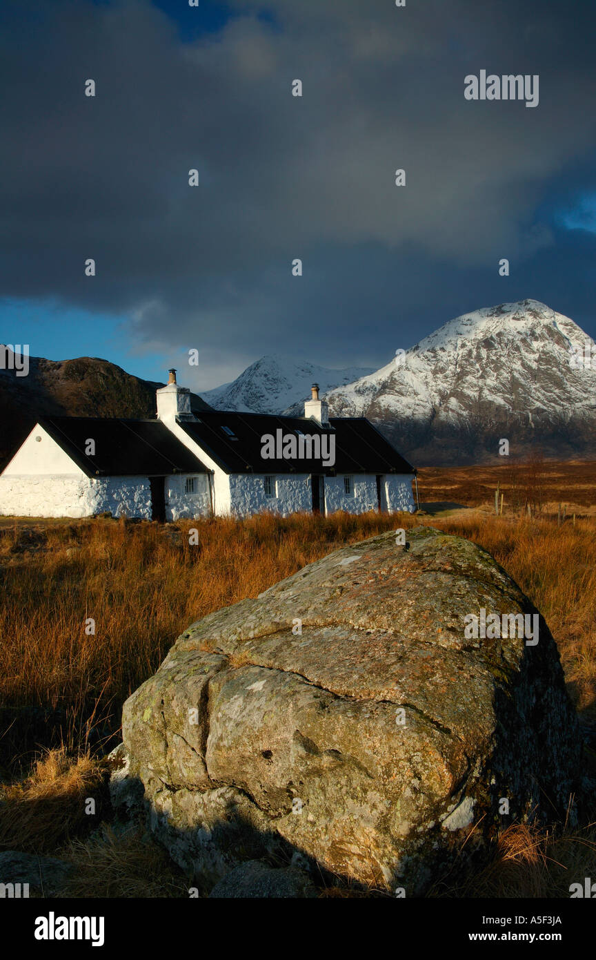 Black Rock Cottage, with with snow capped Buachaille Etive Mor ...