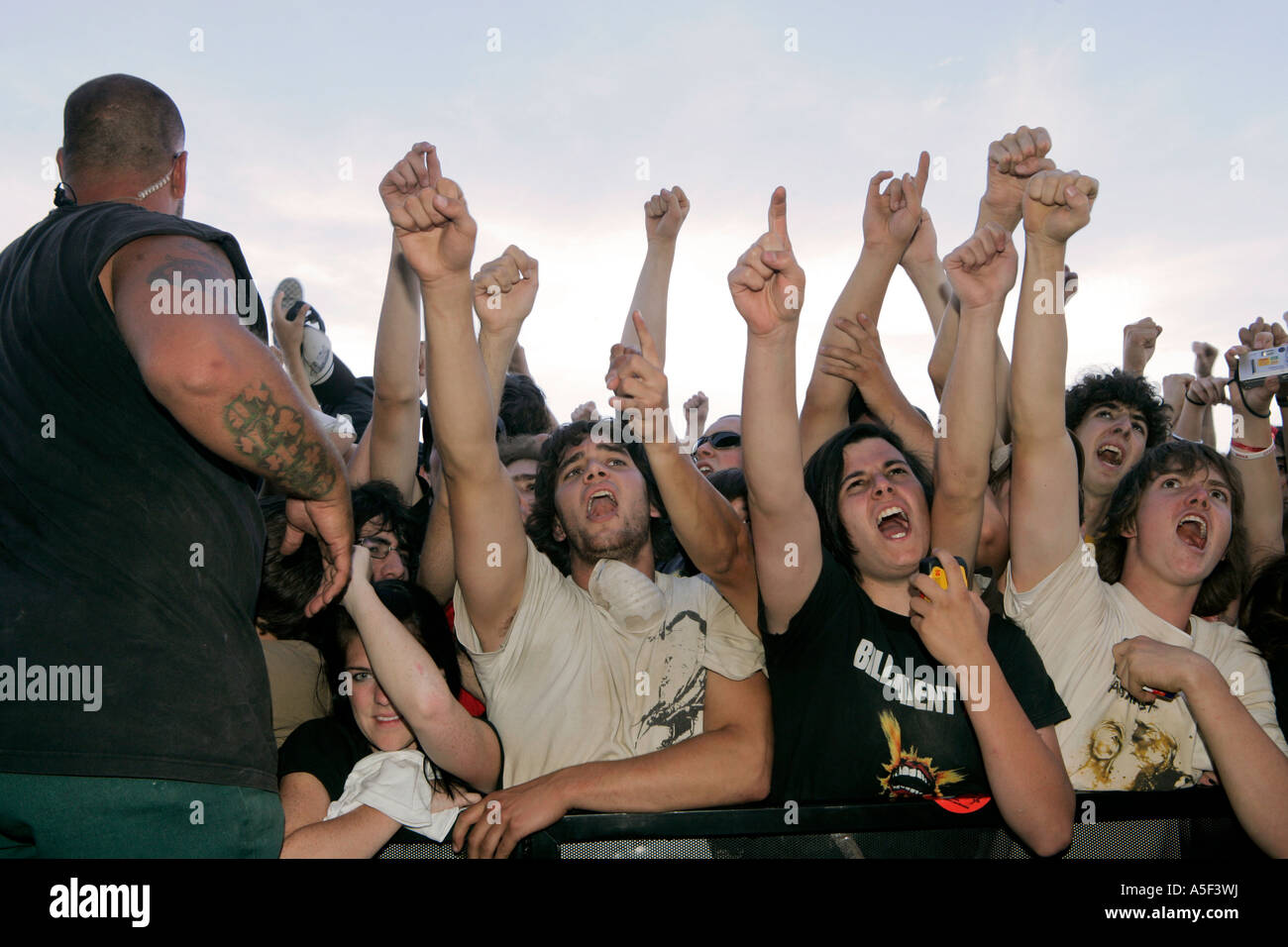 A crowd of saluting fans at an outdoor Summer Music Festival in ...