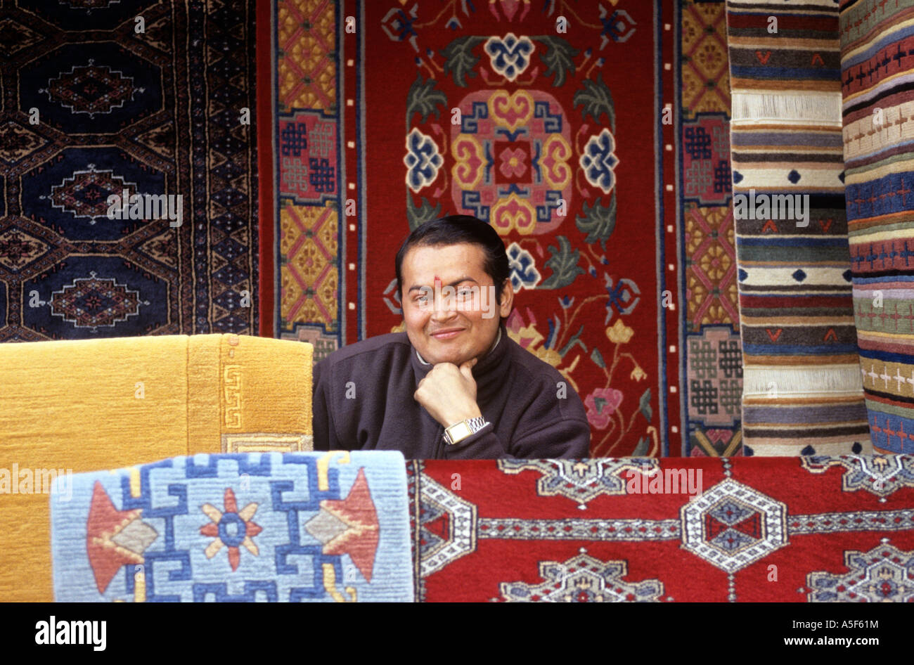 A carpet salesman at one of the local shops in Kathmandu Nepal Stock ...
