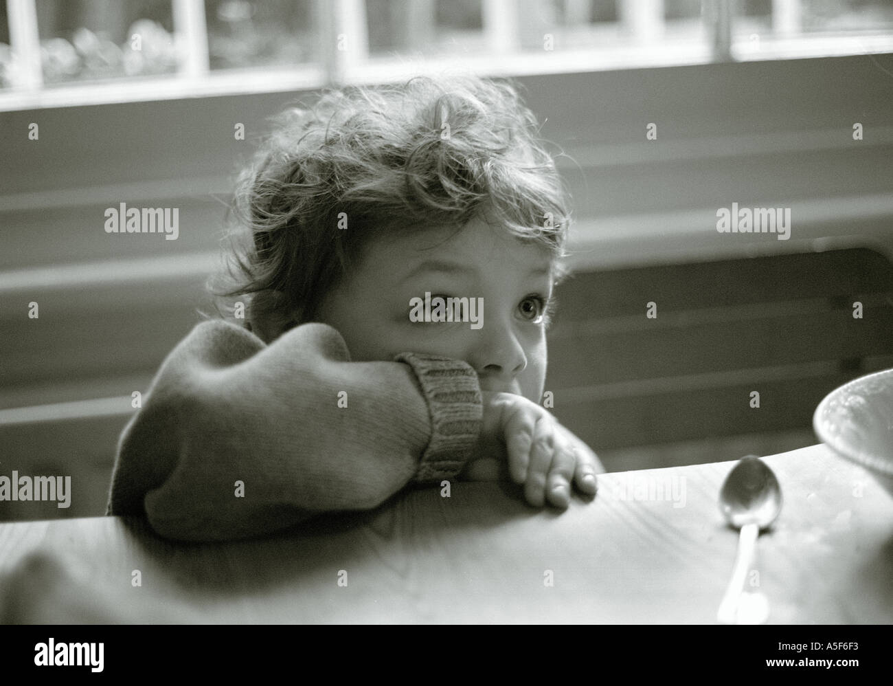 Boy peering hi-res stock photography and images - Alamy
