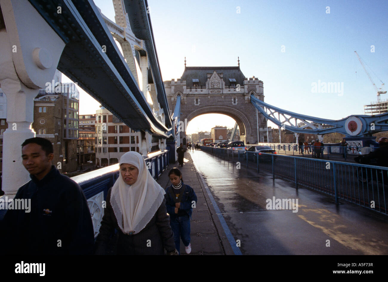 Pedestrians on pavement, Tower Bridge, London, England, UK Stock Photo ...