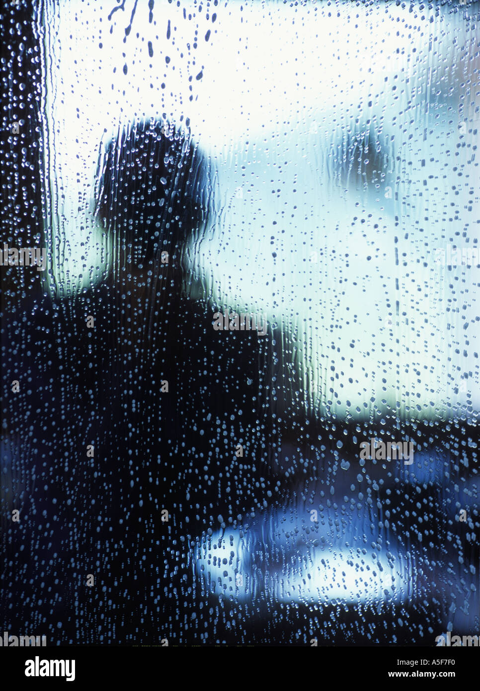 A shadow of a man behind a rainy window Stock Photo - Alamy