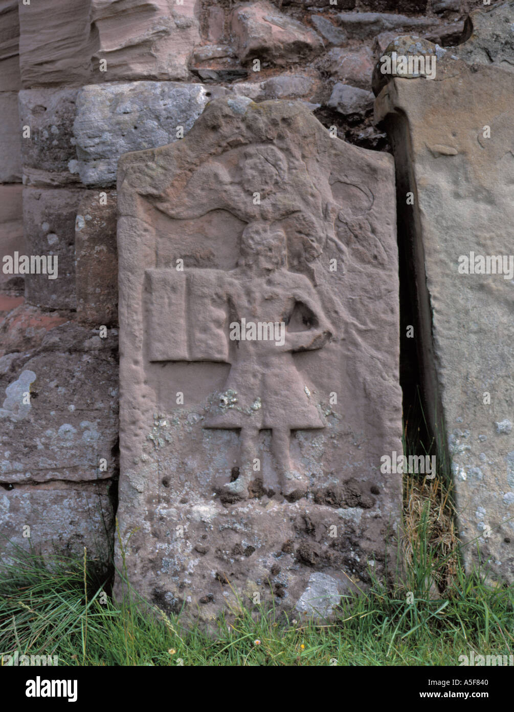 Weathered gravestone in the graveyard of Coldingham Priory, Coldingham ...