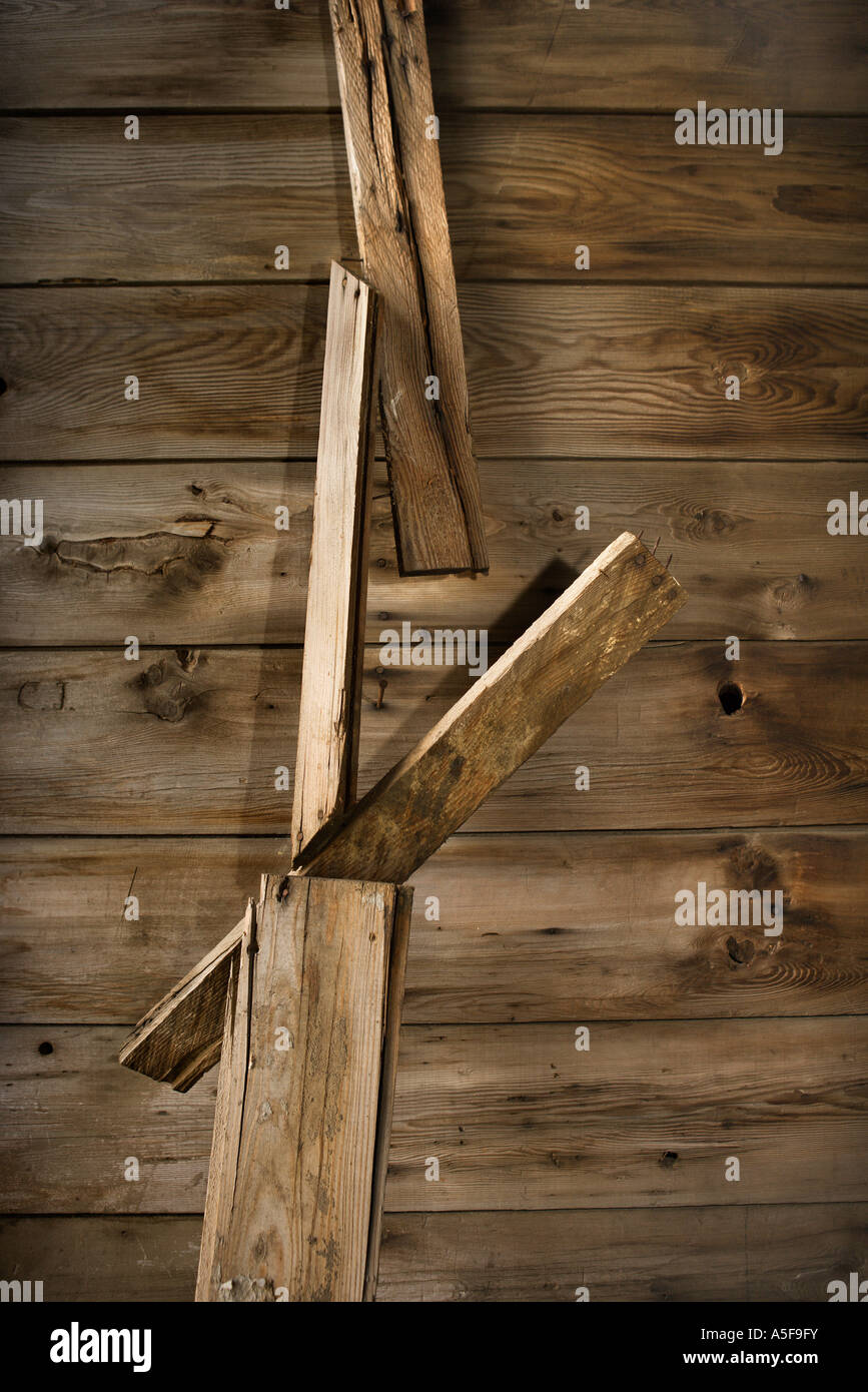 Close up of side of rustic wooden building with wood pieces hanging ...