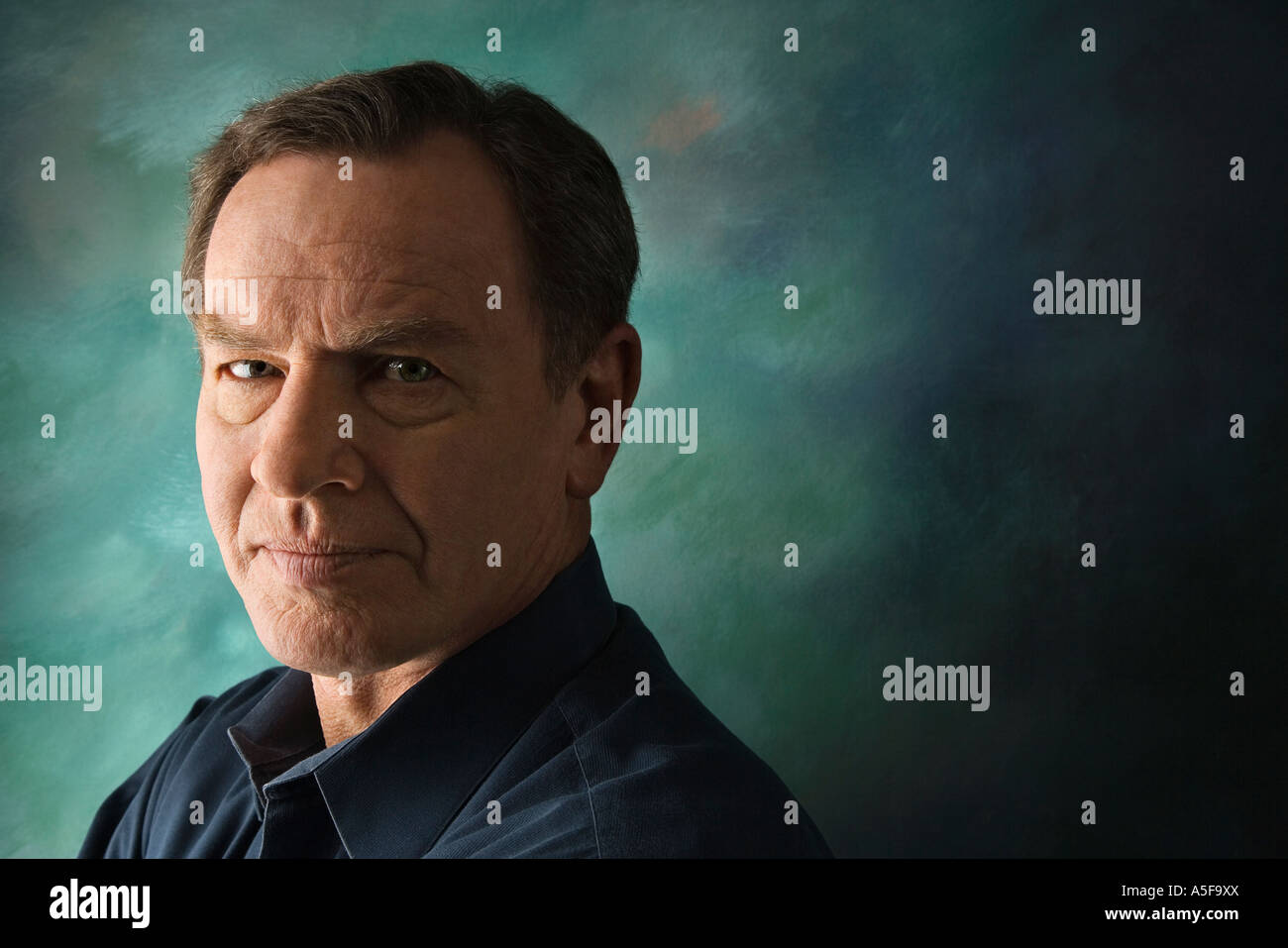 Serious middle aged Caucasian man on studio background Stock Photo - Alamy