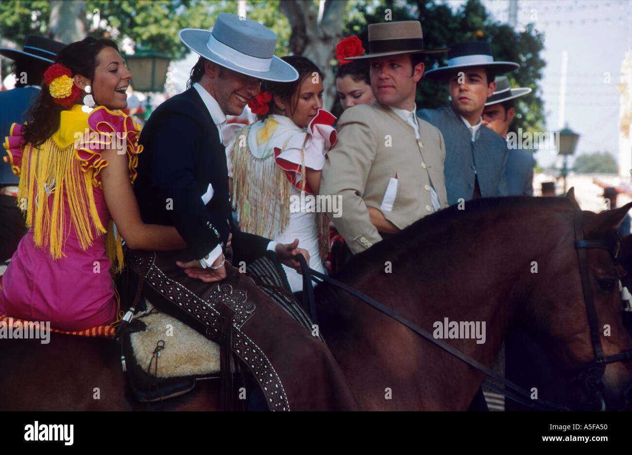 Couples on Horseback at the Seville Spring Fair Stock Photo - Alamy