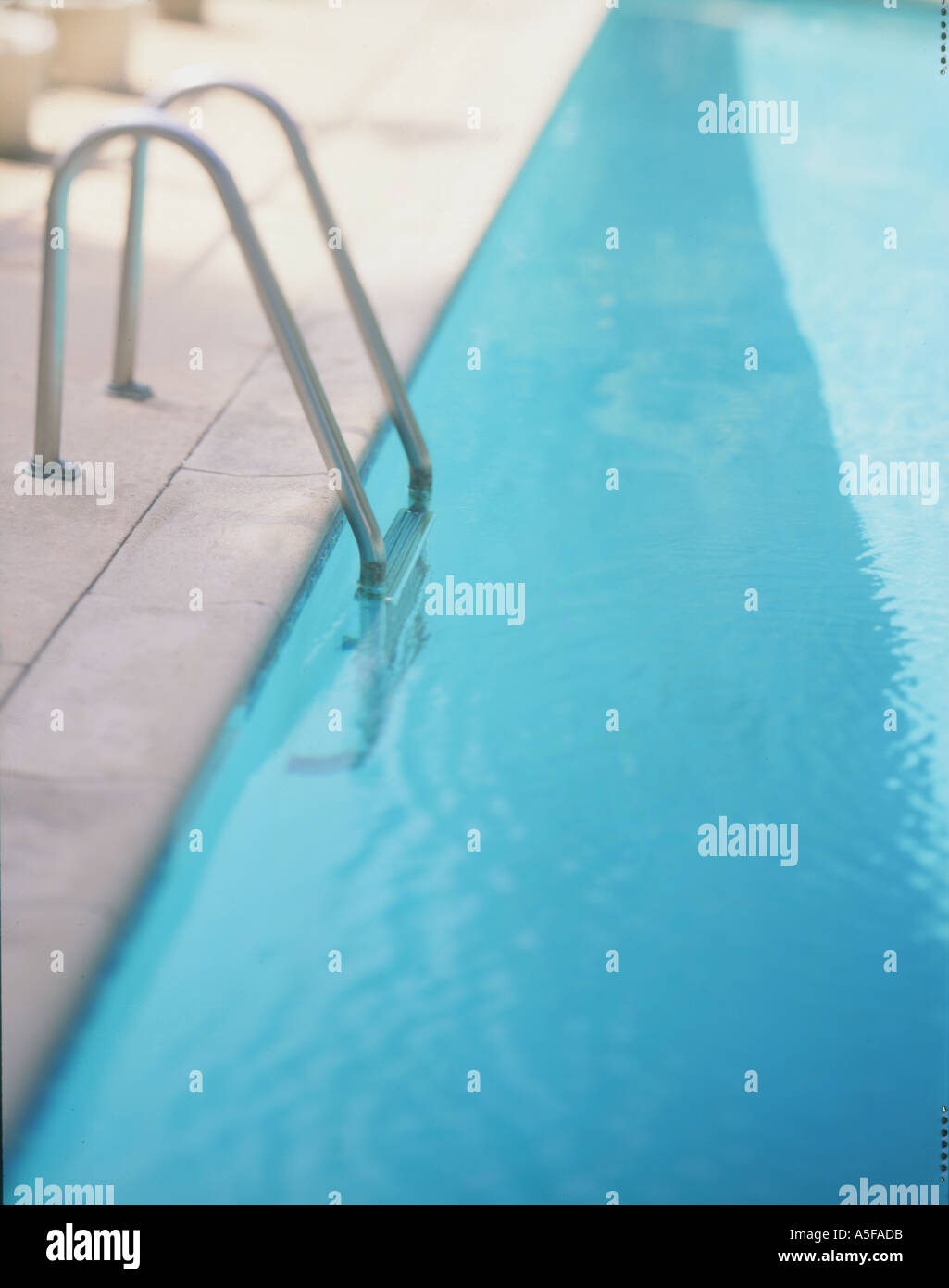 ladder by side of swimming pool Stock Photo - Alamy