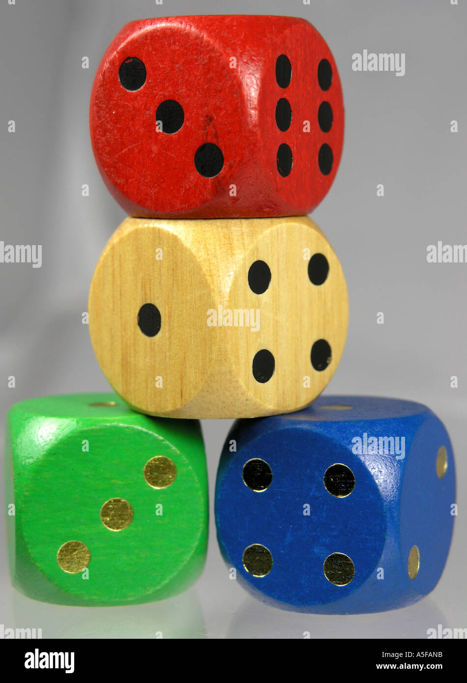 Wooden coloured dice in stack hi-res stock photography and images - Alamy