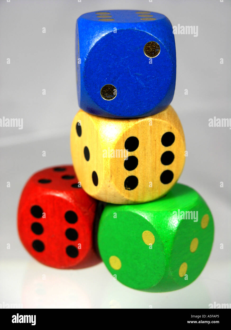 Wooden coloured dice in stack hi-res stock photography and images - Alamy