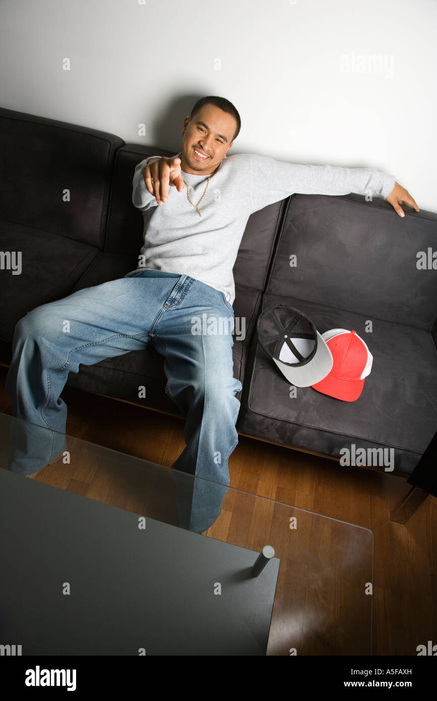 Young man pointing viewer hi-res stock photography and images - Alamy