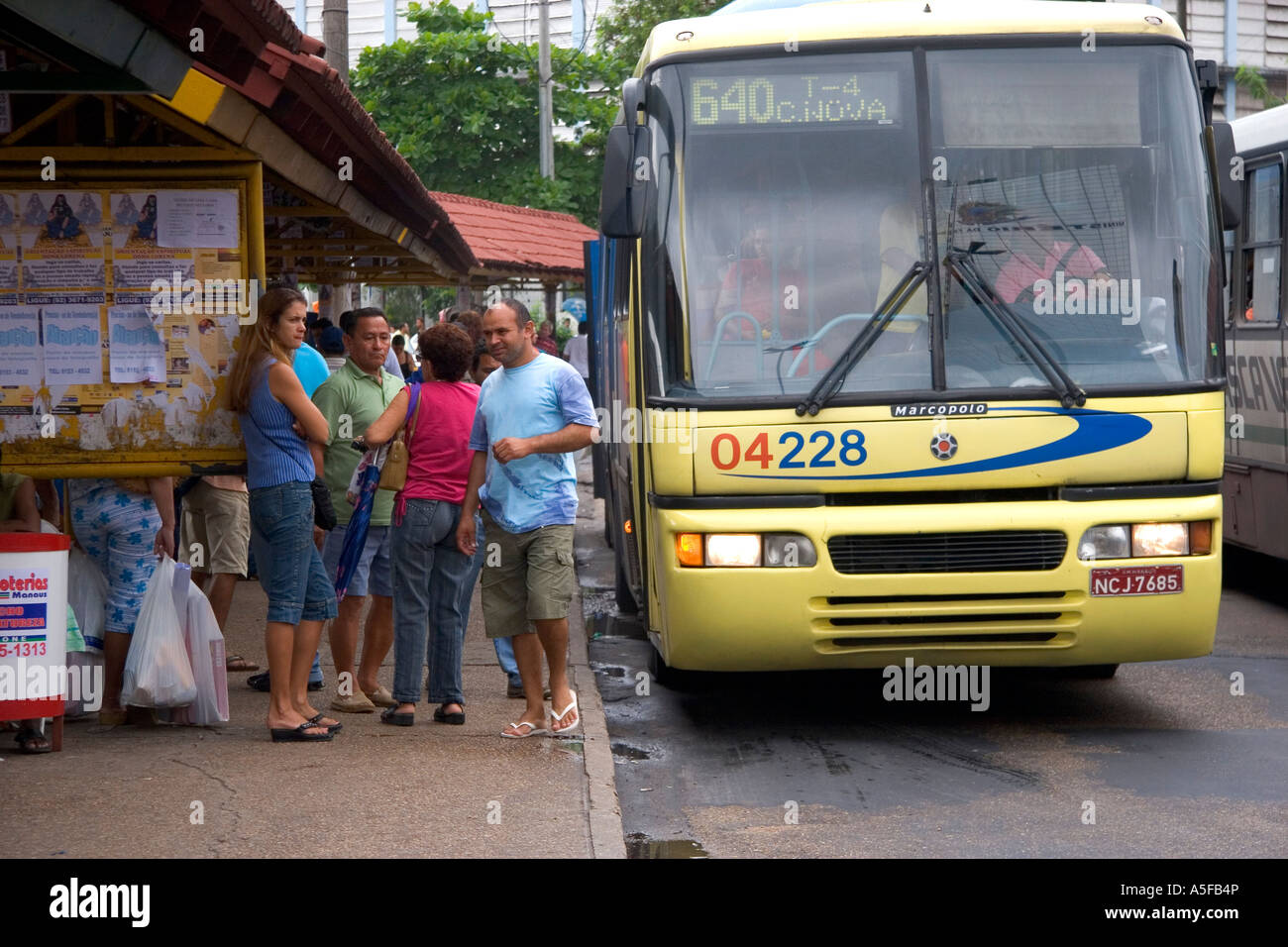 People wait at a bus stop in Manaus Brazil Stock Photo - Alamy