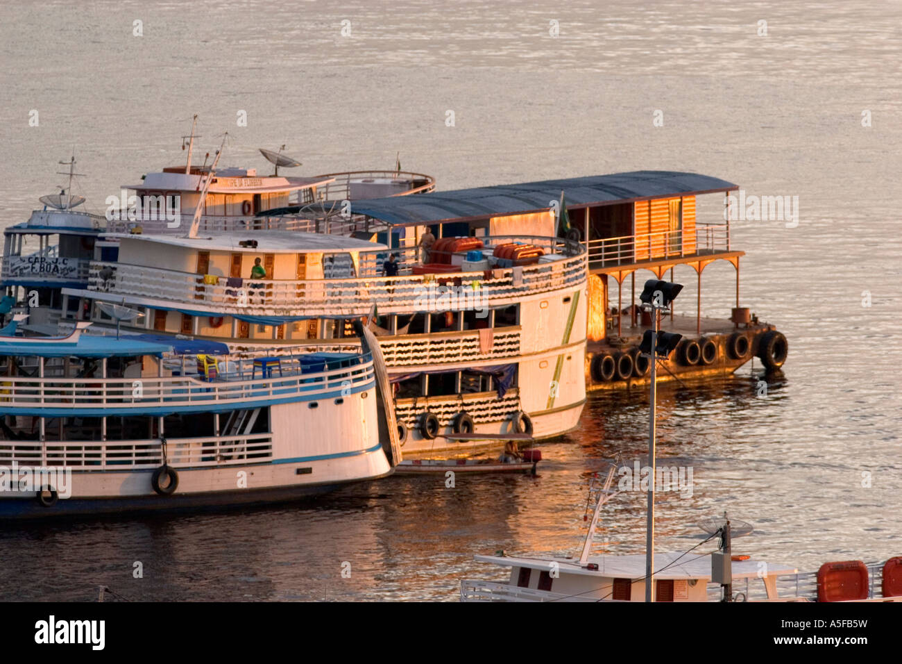 Amazon river boats docked at sunrise in Manaus Brazil Stock Photo - Alamy