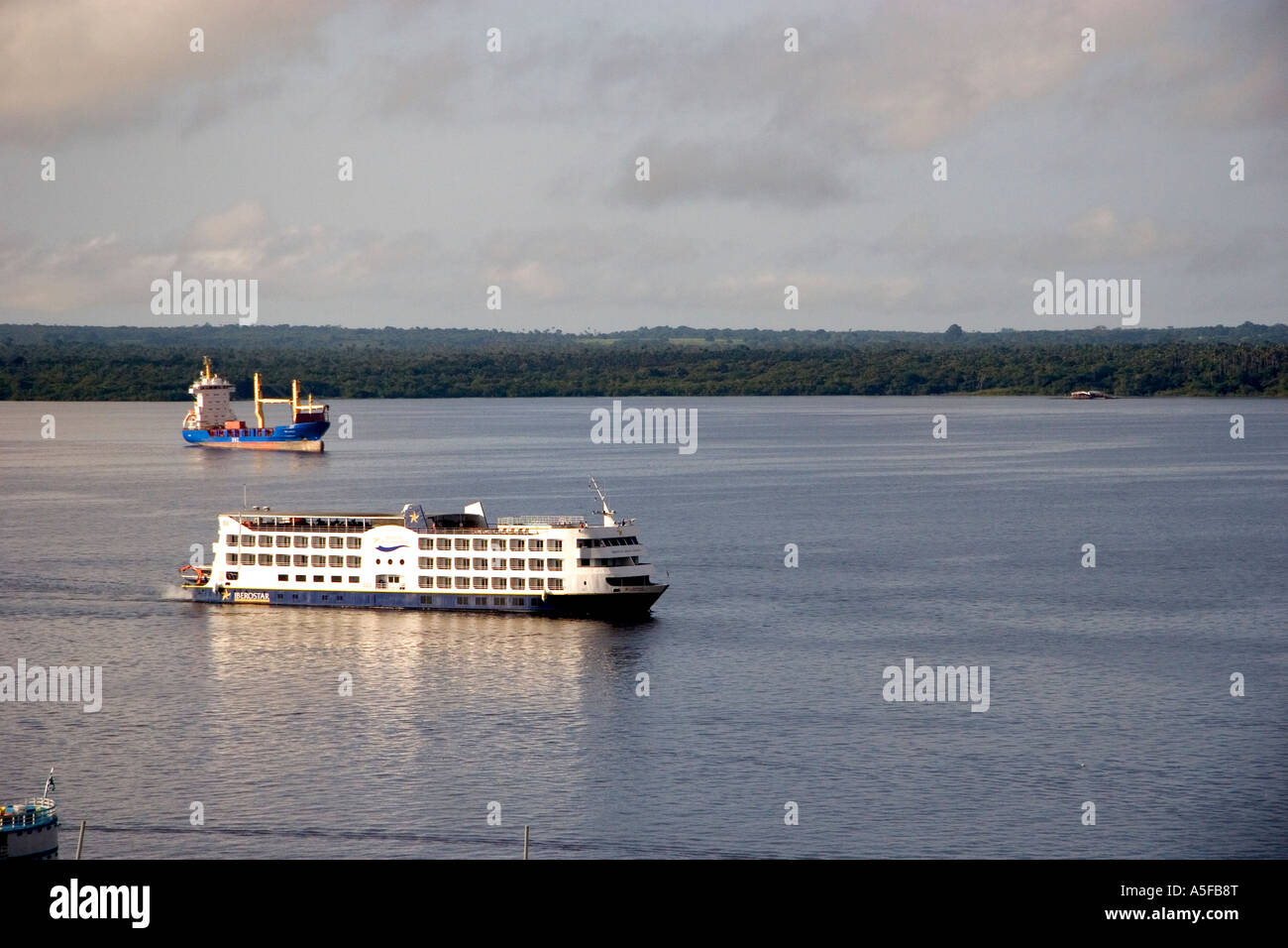 Amazon River cruise boat and container ship at Manaus Brazil Stock ...