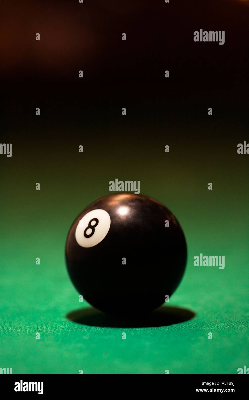 Eight ball on green billiards table Stock Photo - Alamy