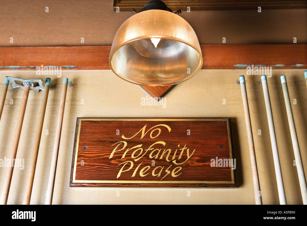 Low angle of sign in nightclub requesting no profanity Stock Photo - Alamy