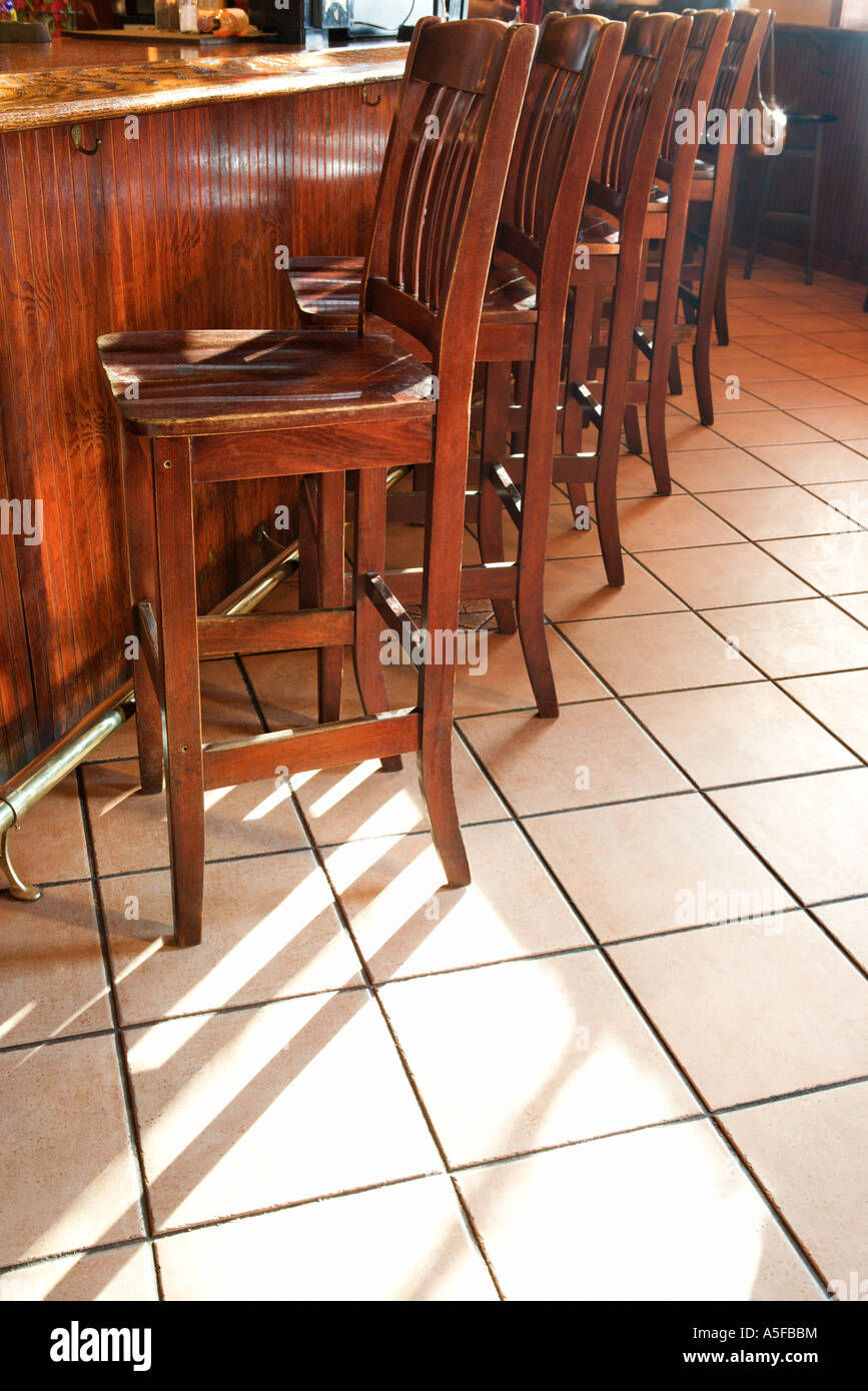 Chairs lined up at bar in nightclub or restaurant Stock Photo - Alamy