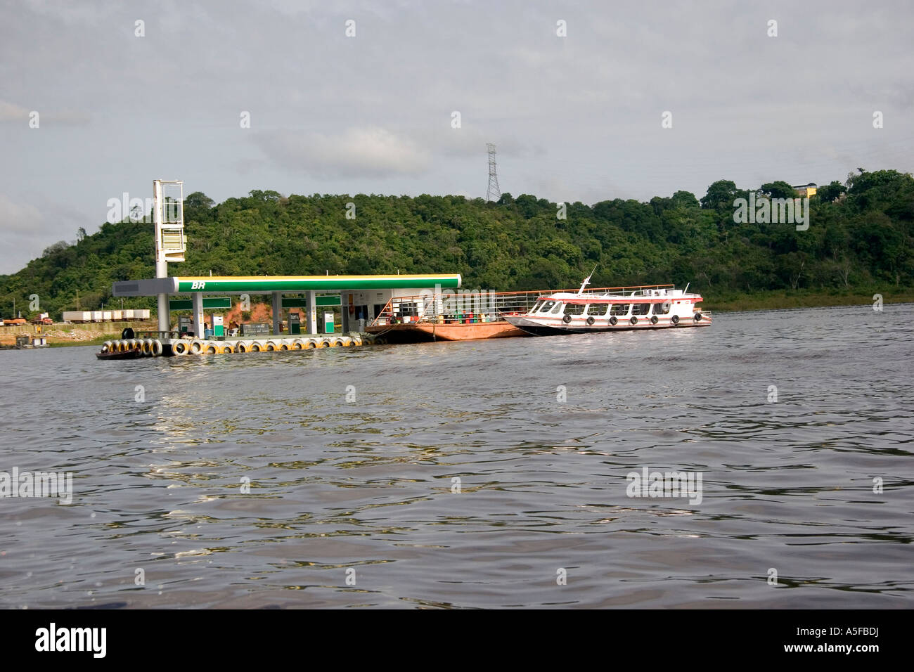 Amazon river boats fuel up at a floating gas station in Manaus Brazil ...