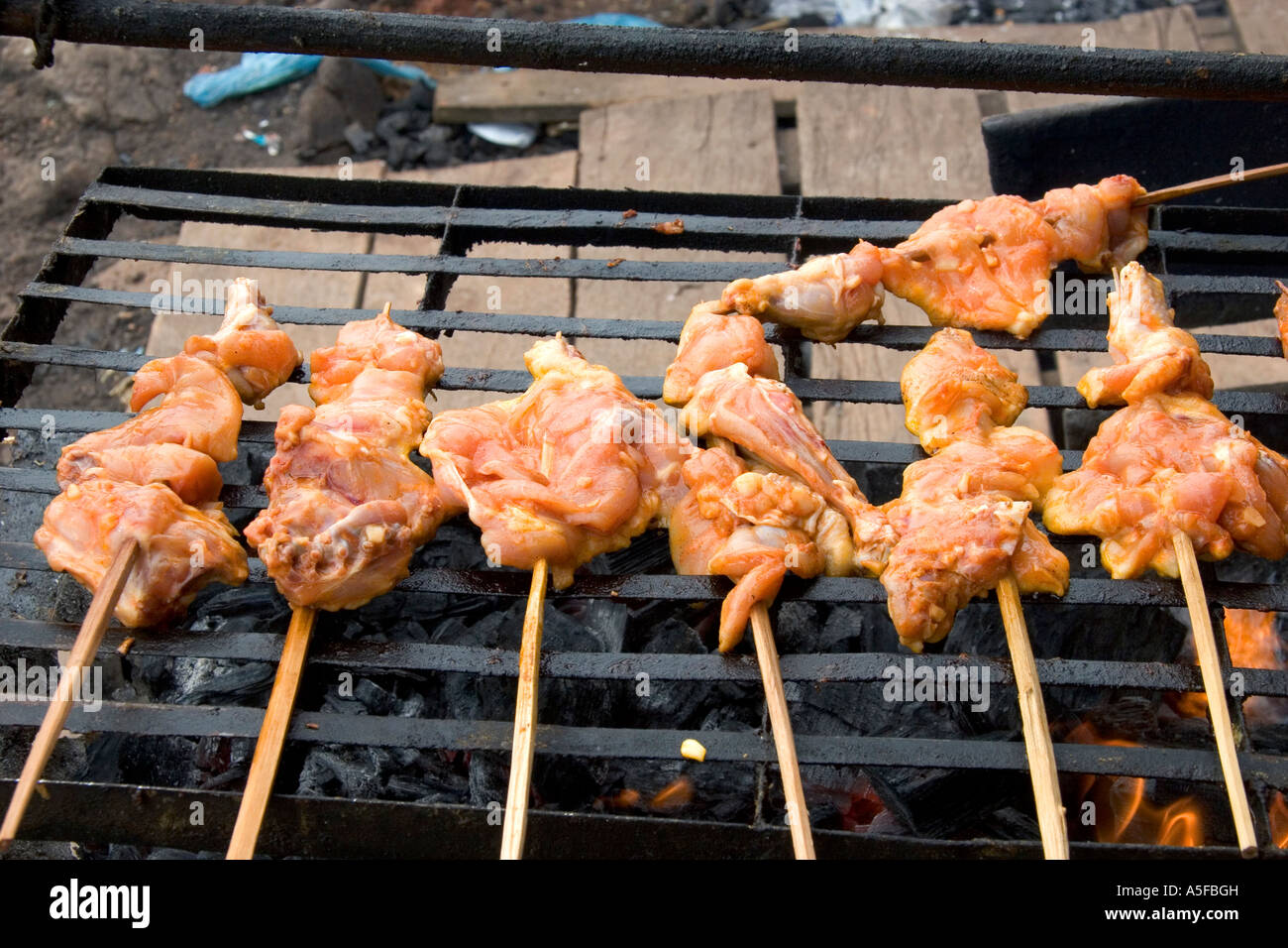 Chicken being cooked on a grill in the Amazon Brazil Stock Photo - Alamy