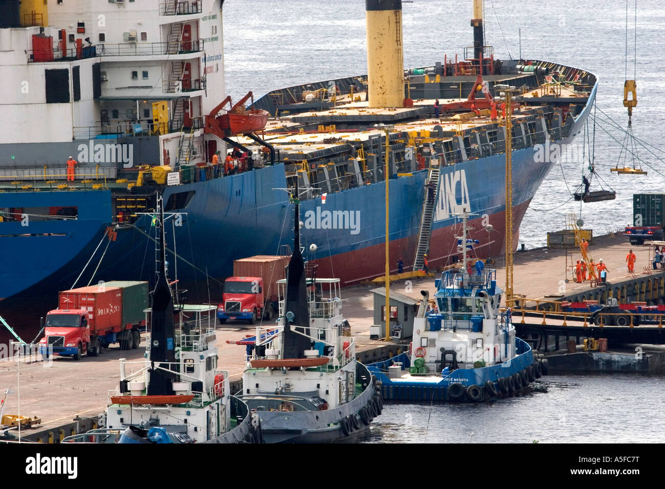 Containers being loaded onto a ship at the port in Manaus Brazil Stock ...