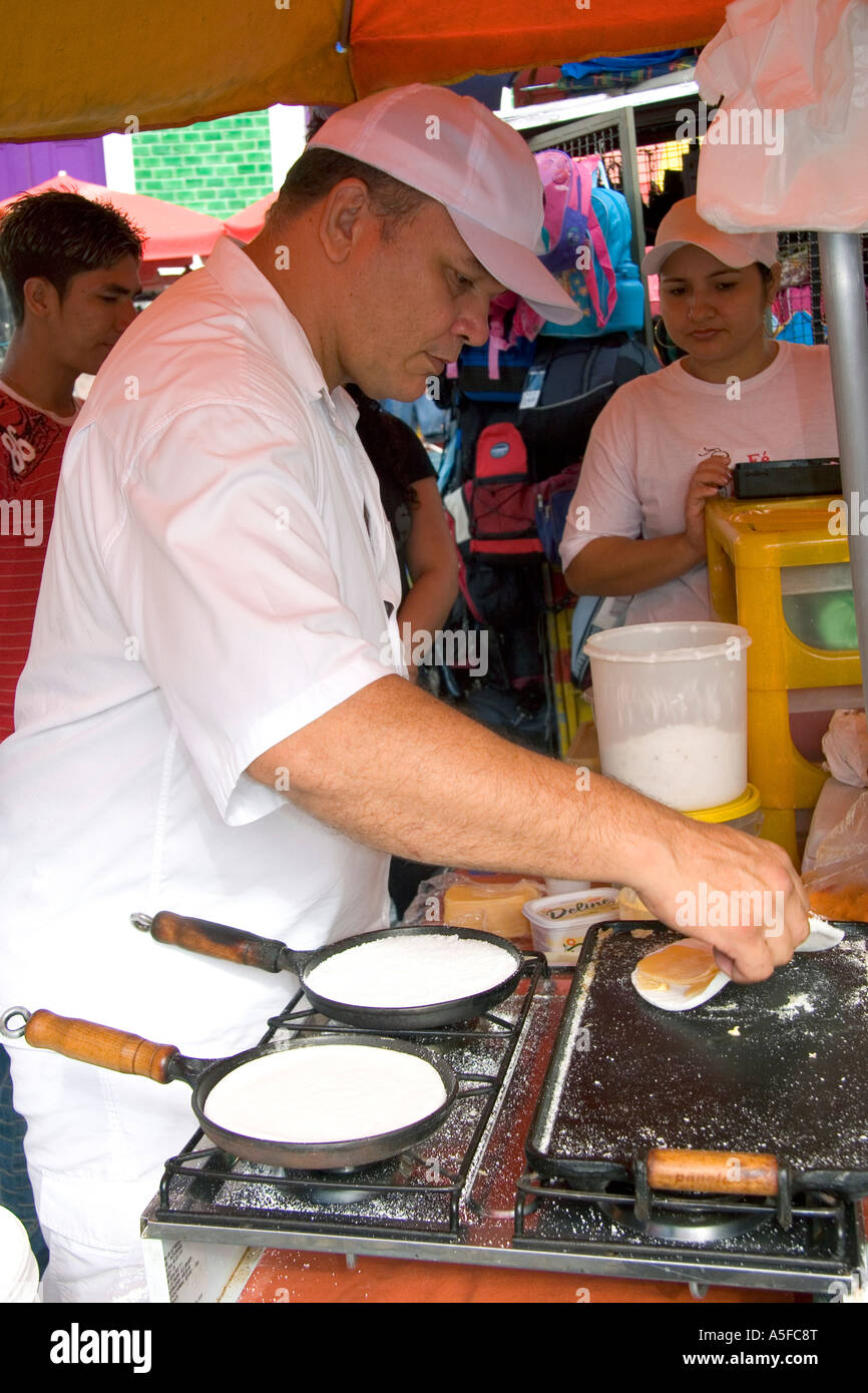 A man cooking tapioca into a kind of pancake in Manaus Brazil Stock ...