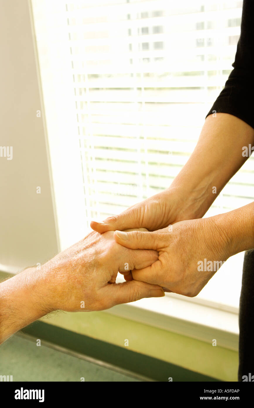Elderly male arthritic hands hi-res stock photography and images - Alamy