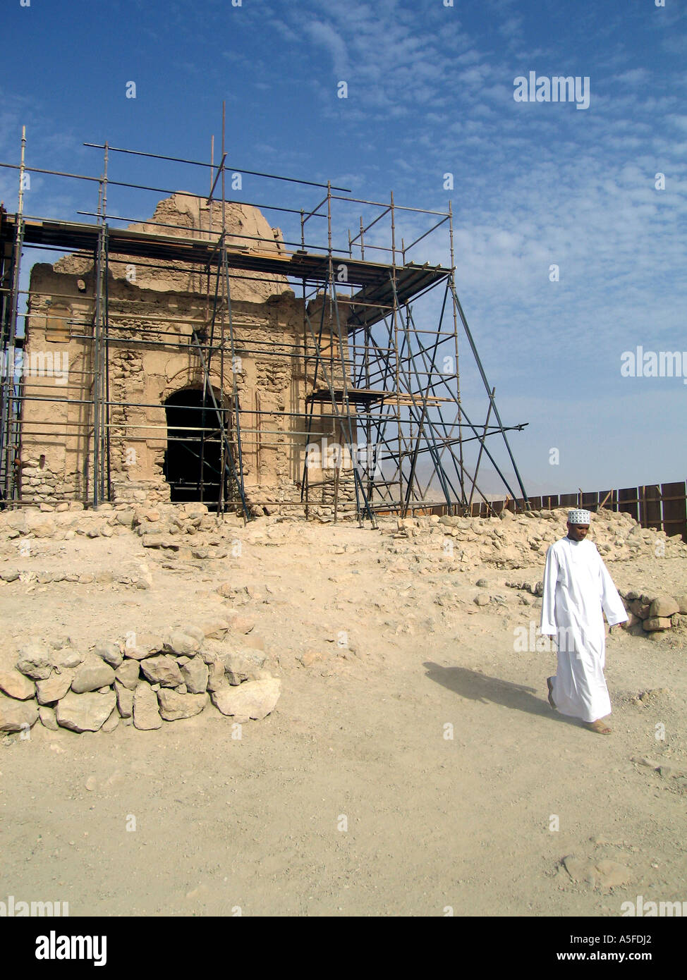 Bibi Myram tomb, Qalhat, Oman, Omani man walking away from the site ...