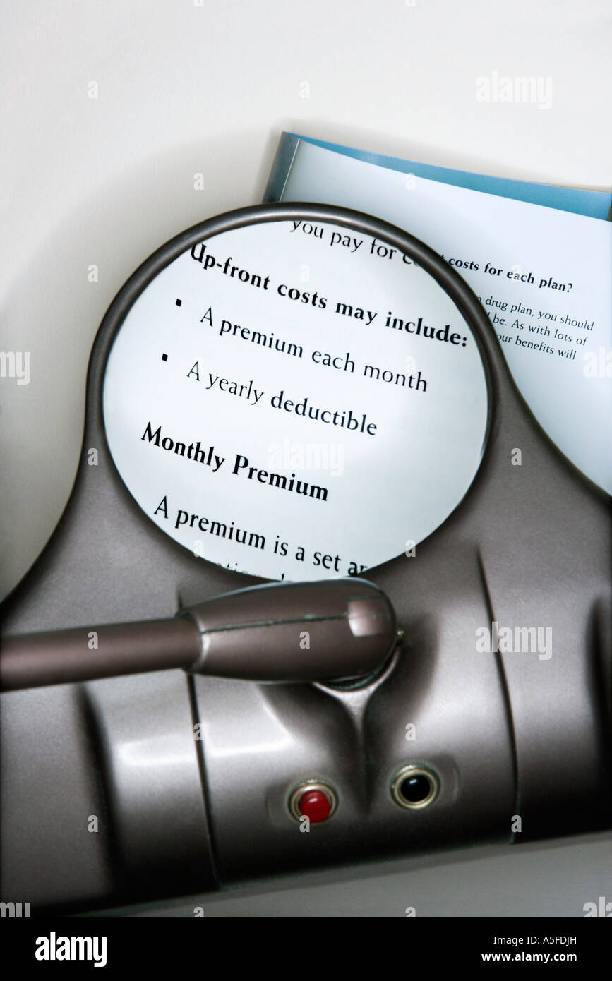Vision magnifying glass used to view health insurance information Stock ...