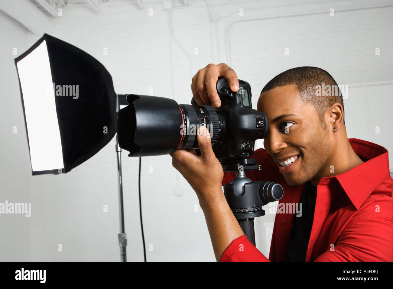 Camera with flash african photographer hi-res stock photography and ...