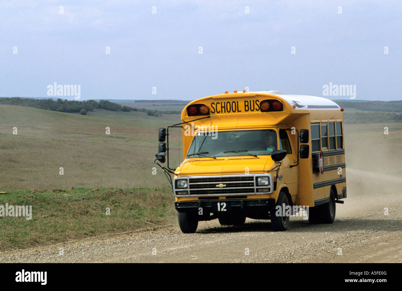 A school bus traveling on a rural dirt road in Oklahoma Stock Photo - Alamy
