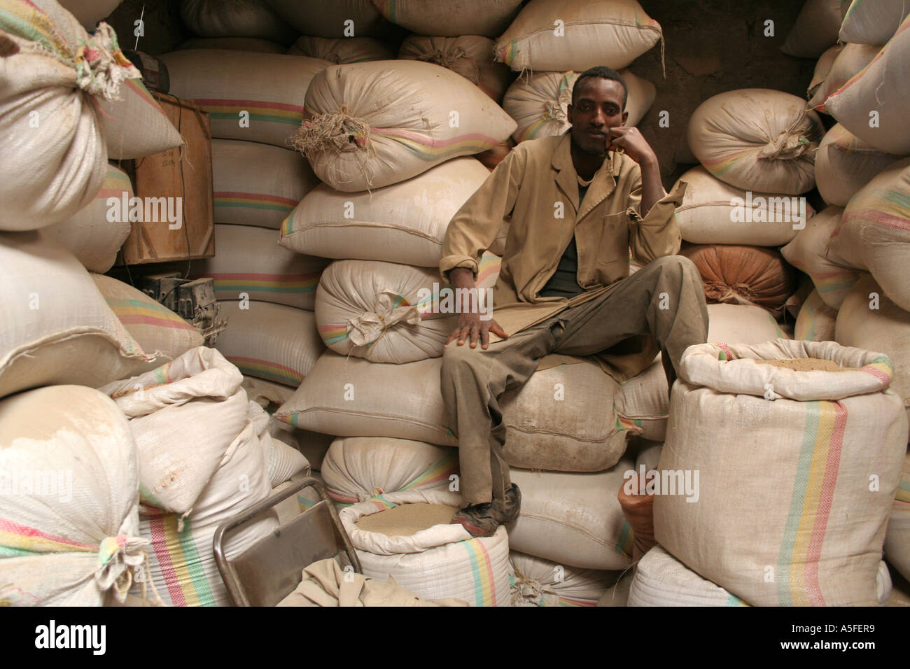 Addis Ababa, Ethiopia, young man in a grain milling factory Stock Photo ...