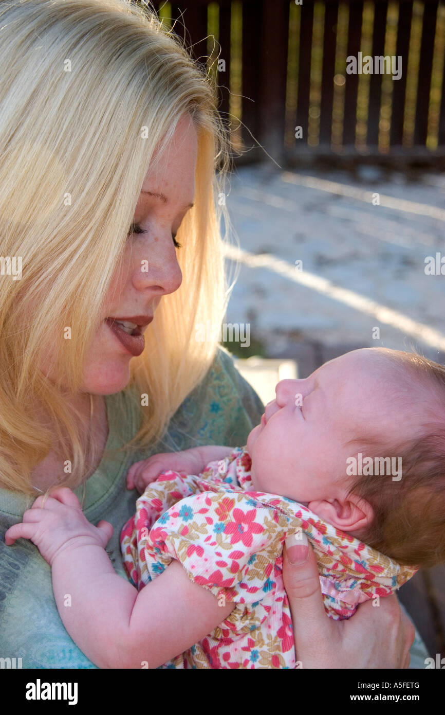 Mother holding her newborn baby girl Stock Photo - Alamy