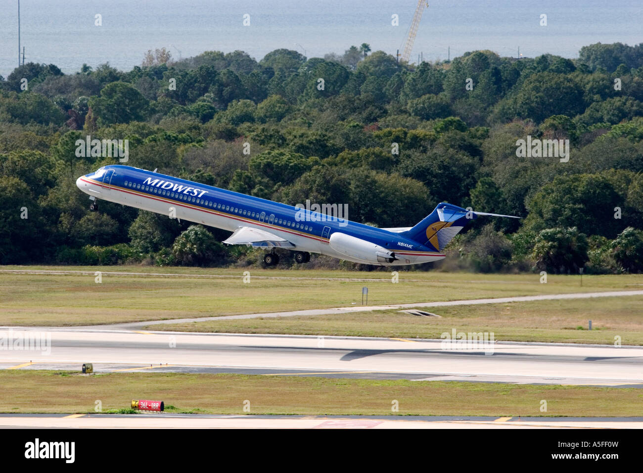 Midwest MD 80 airplane taking off from the Tampa International Airport ...
