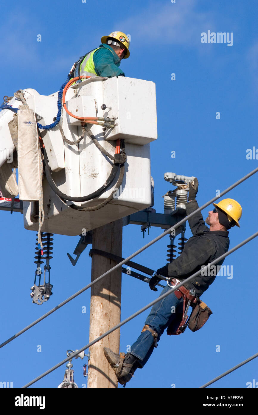 Electric power lineman installing new lines in Boise Idaho Stock Photo ...