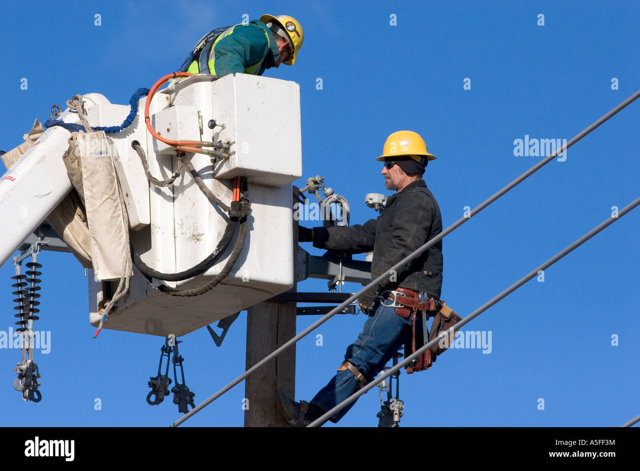 Electric power lineman installing new lines in Boise Idaho Stock Photo ...