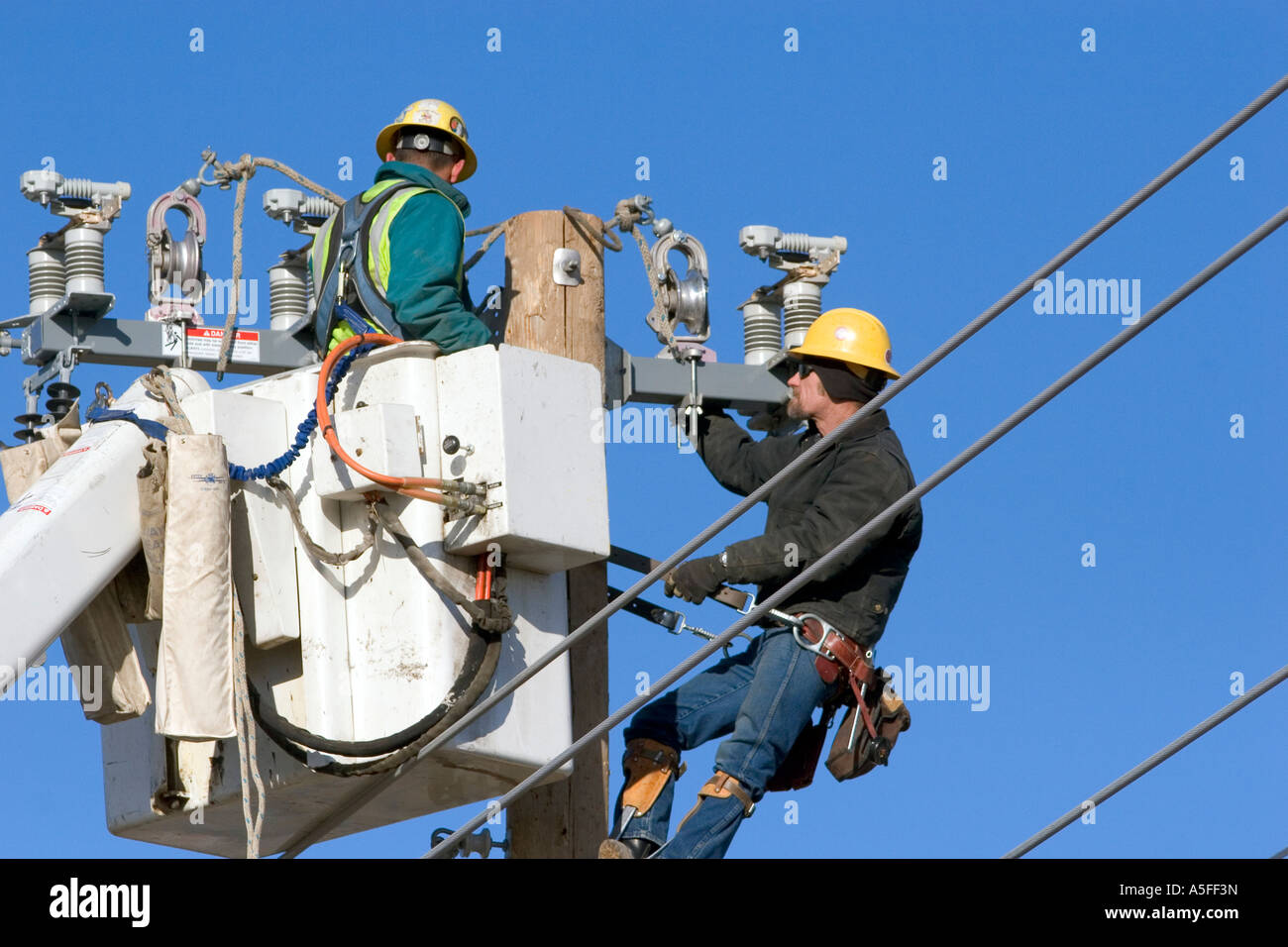 Electric power lineman installing new lines in Boise Idaho Stock Photo ...