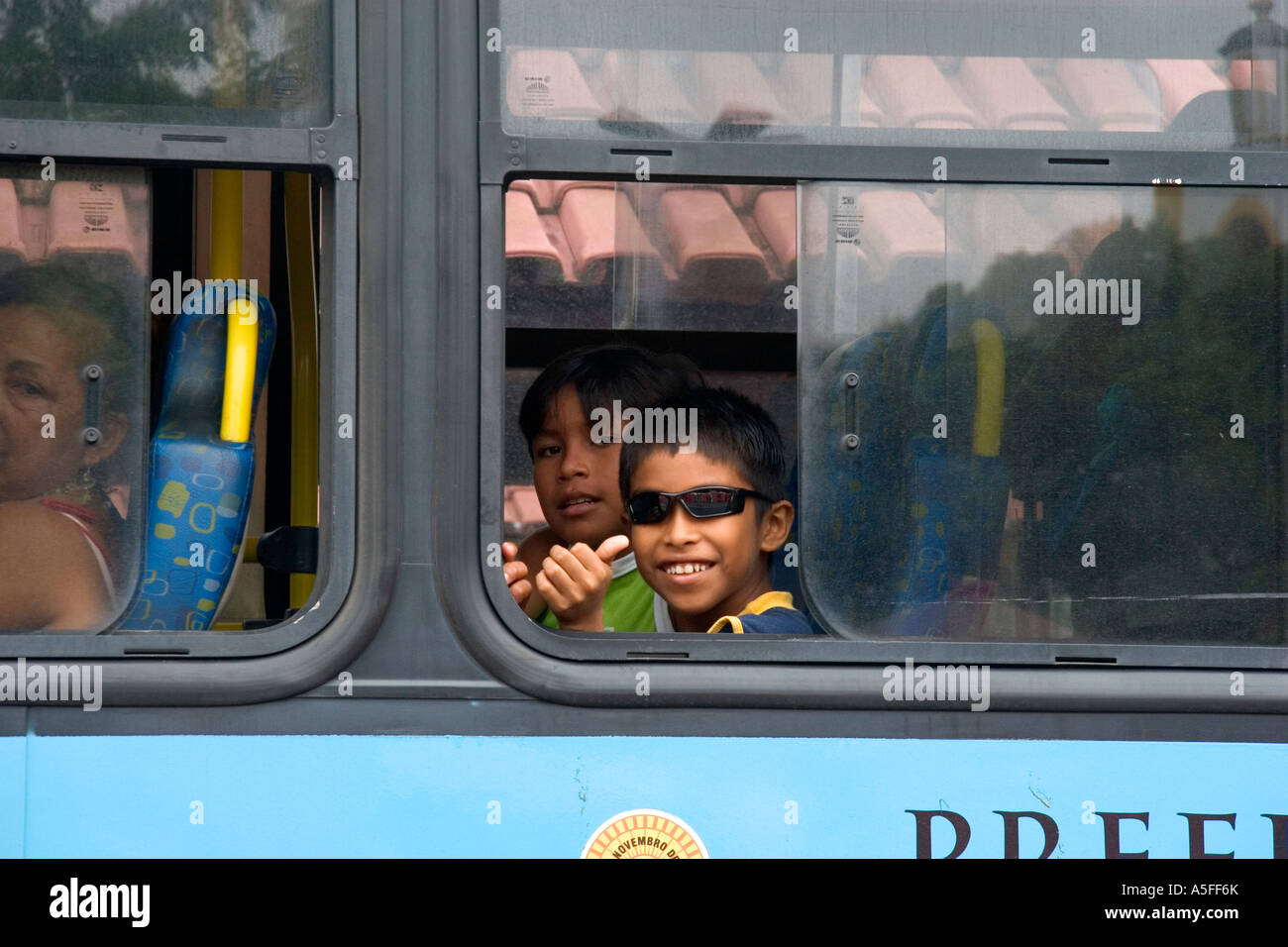 Brazilian boys riding a bus in Manaus Brazil Stock Photo - Alamy