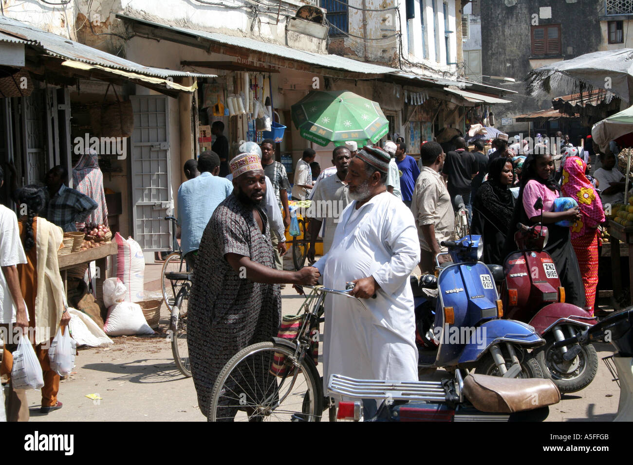 ZANZIBAR: Locals in the narrow streets of Stonetown, Zanzibar, Tanzania ...