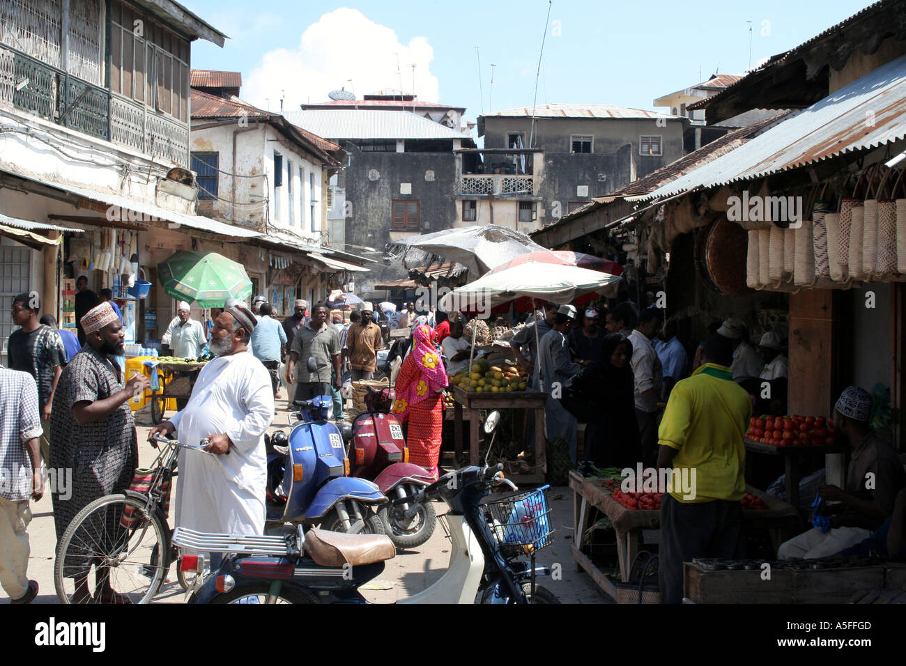 ZANZIBAR: Locals in the narrow streets of Stonetown, Zanzibar, Tanzania ...